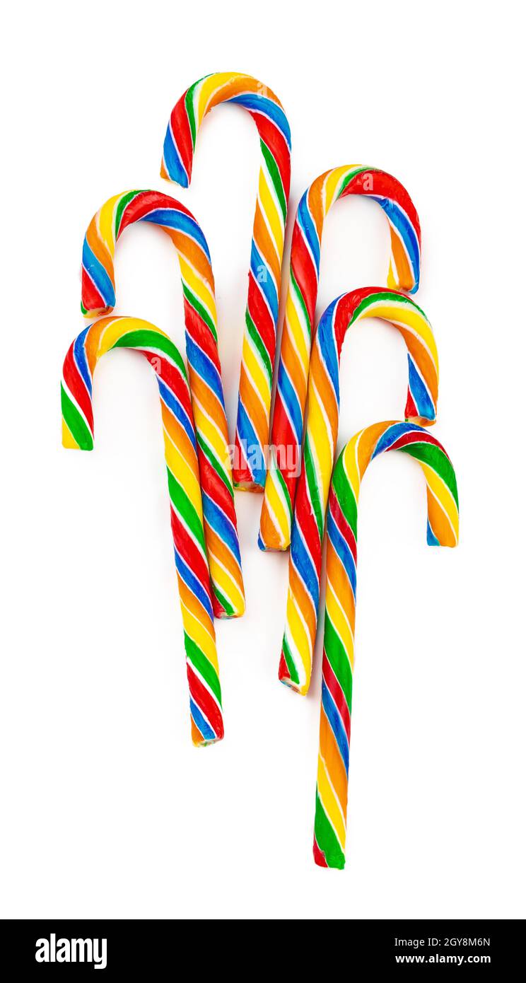 Rainbow colored candy cane isolated on white background Stock Photo - Alamy