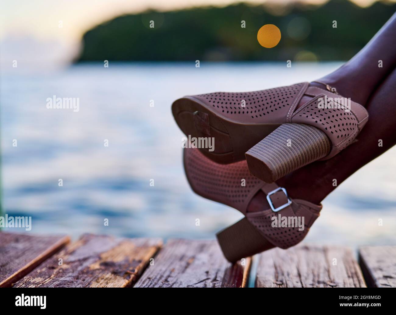 Shoes on the female toes Stock Photo - Alamy