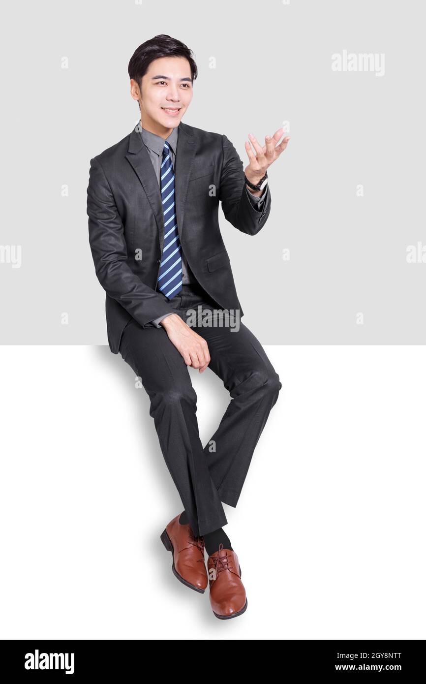 Positive chinese man sitting hi-res stock photography and images - Alamy