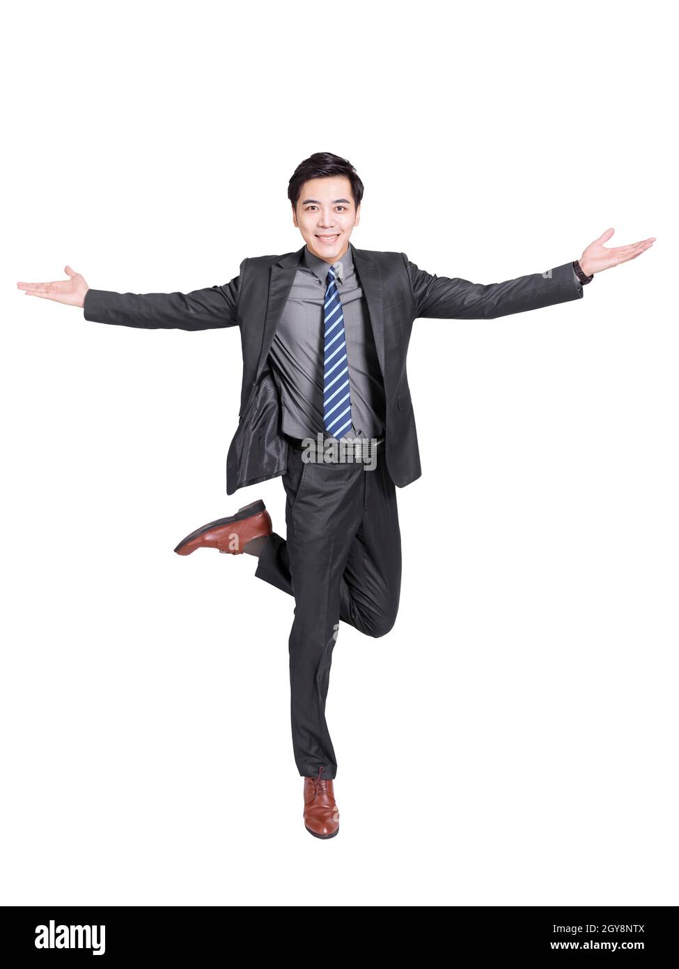 Young businessman standing and his hands wide open. Isolated on white ...