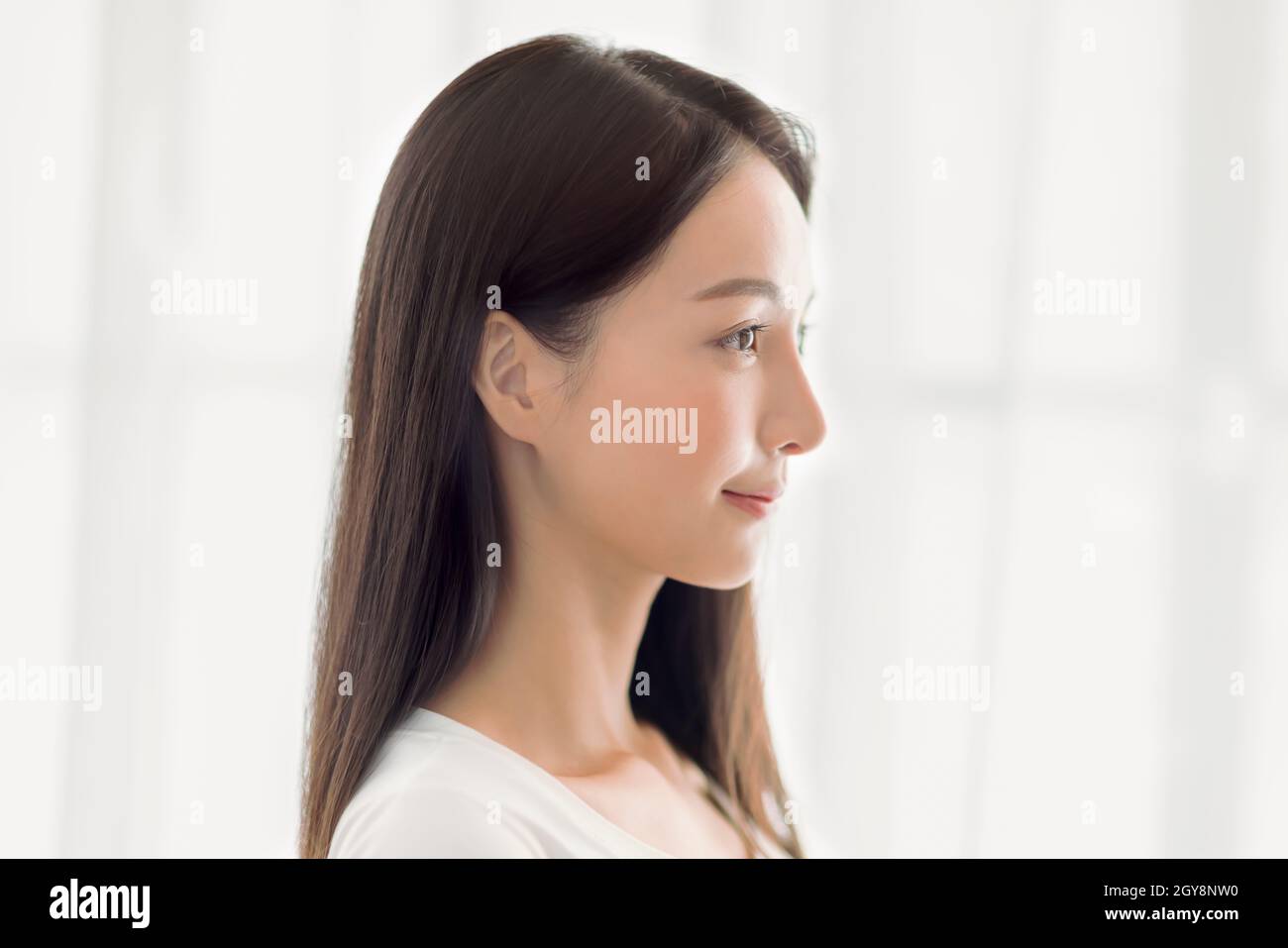 side view of beautiful young asian woman face with clean healthy skin ...