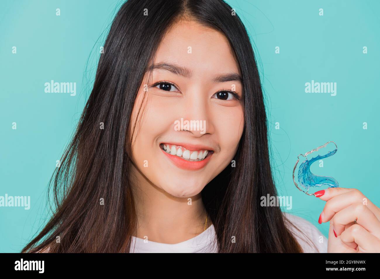 Portrait young Asian beautiful woman smiling holding silicone ...