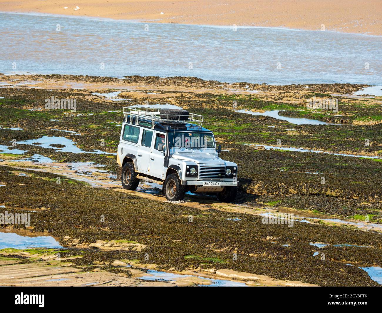 Land Rover 4 Wheel drive on the beach Hilbre Island Wirral UK Stock ...