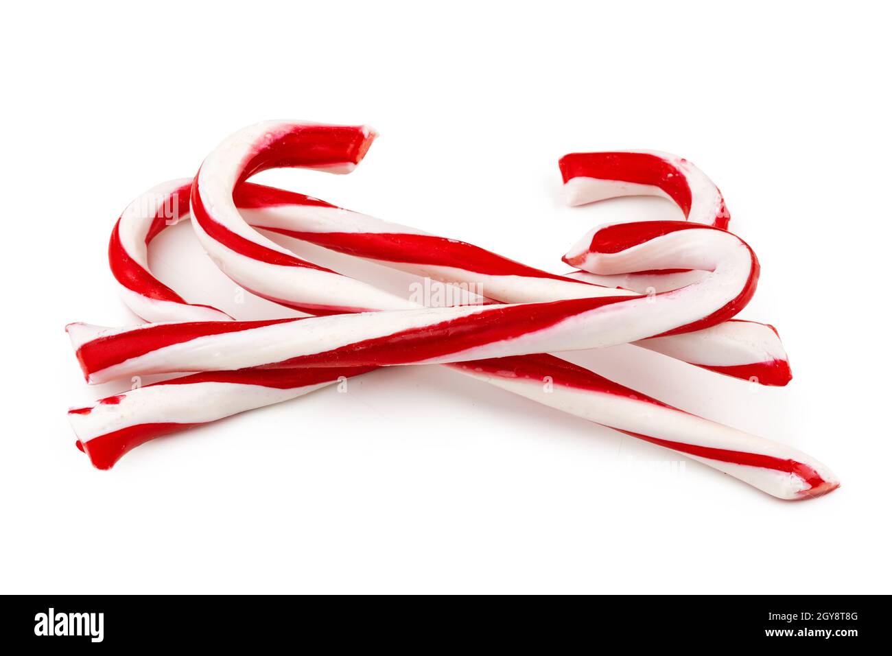 Stack of candy canes isolated on white background Stock Photo - Alamy
