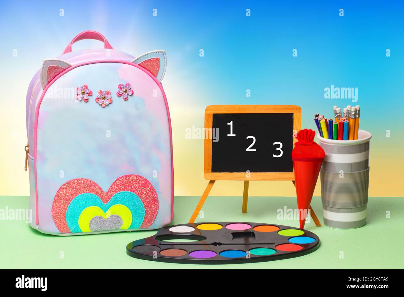 Back to school. Colorful school equipment, a bright school backpack and ...