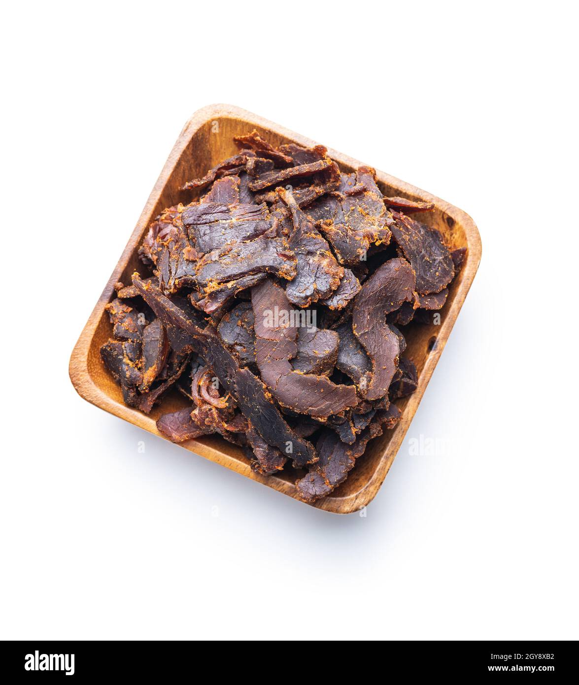 Sliced beef jerky. Dried beef meat in bowl isolated on white background ...