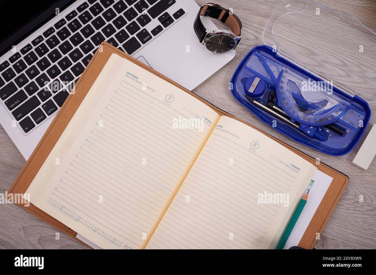 Opened Empty Notepad Over A Laptop With Compass Pen Wristwatch Stock ...