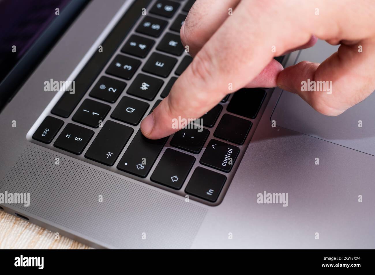 Hands Pressing Computer Keyboard Keys While Writing With Pencil In ...