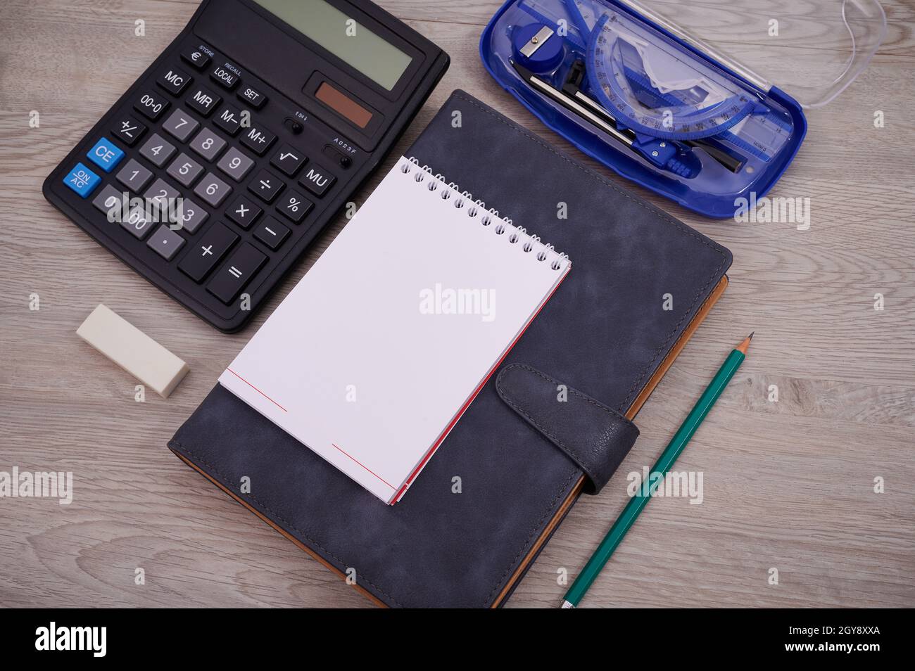 Blank Notebook Page With A Calculator And Geometric Stationery Over ...