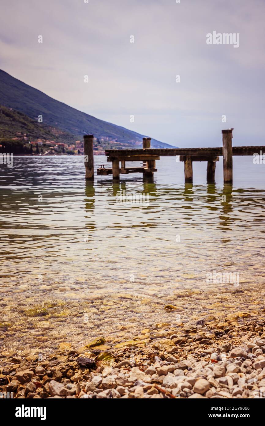 Coastline scenery: wooden dock peer and water Stock Photo - Alamy