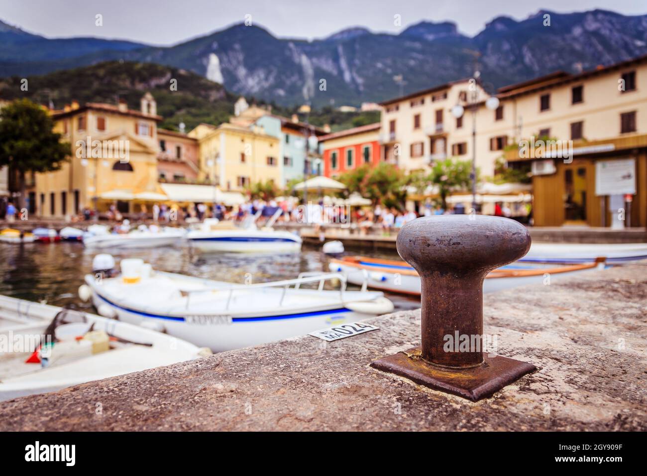 Italian harbour scene, boats in the blurry background Stock Photo - Alamy