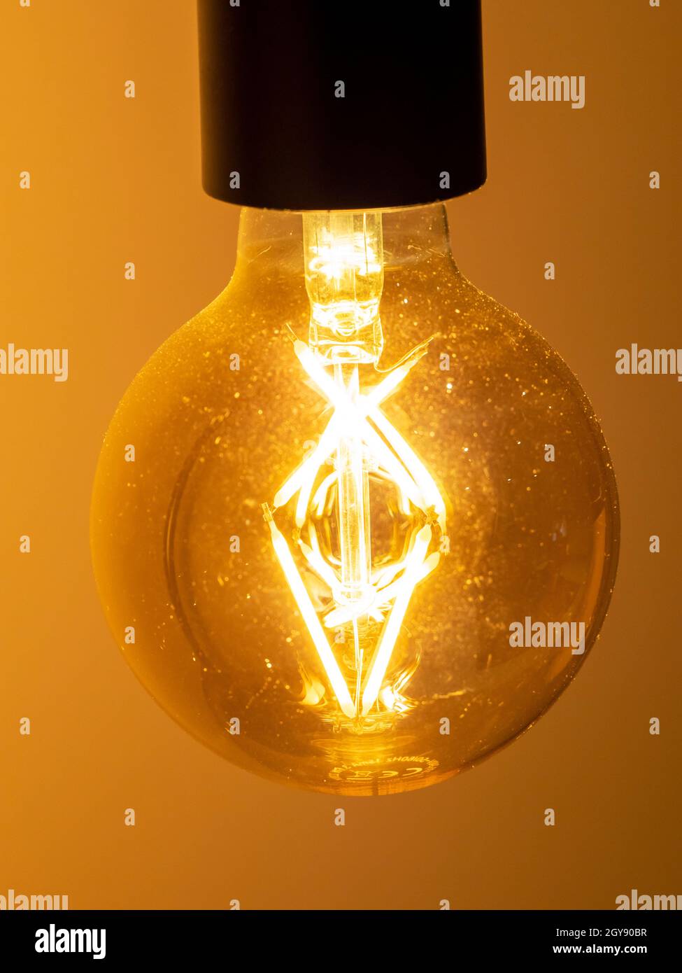 A trendy, retro modern light bulb Stock Photo - Alamy