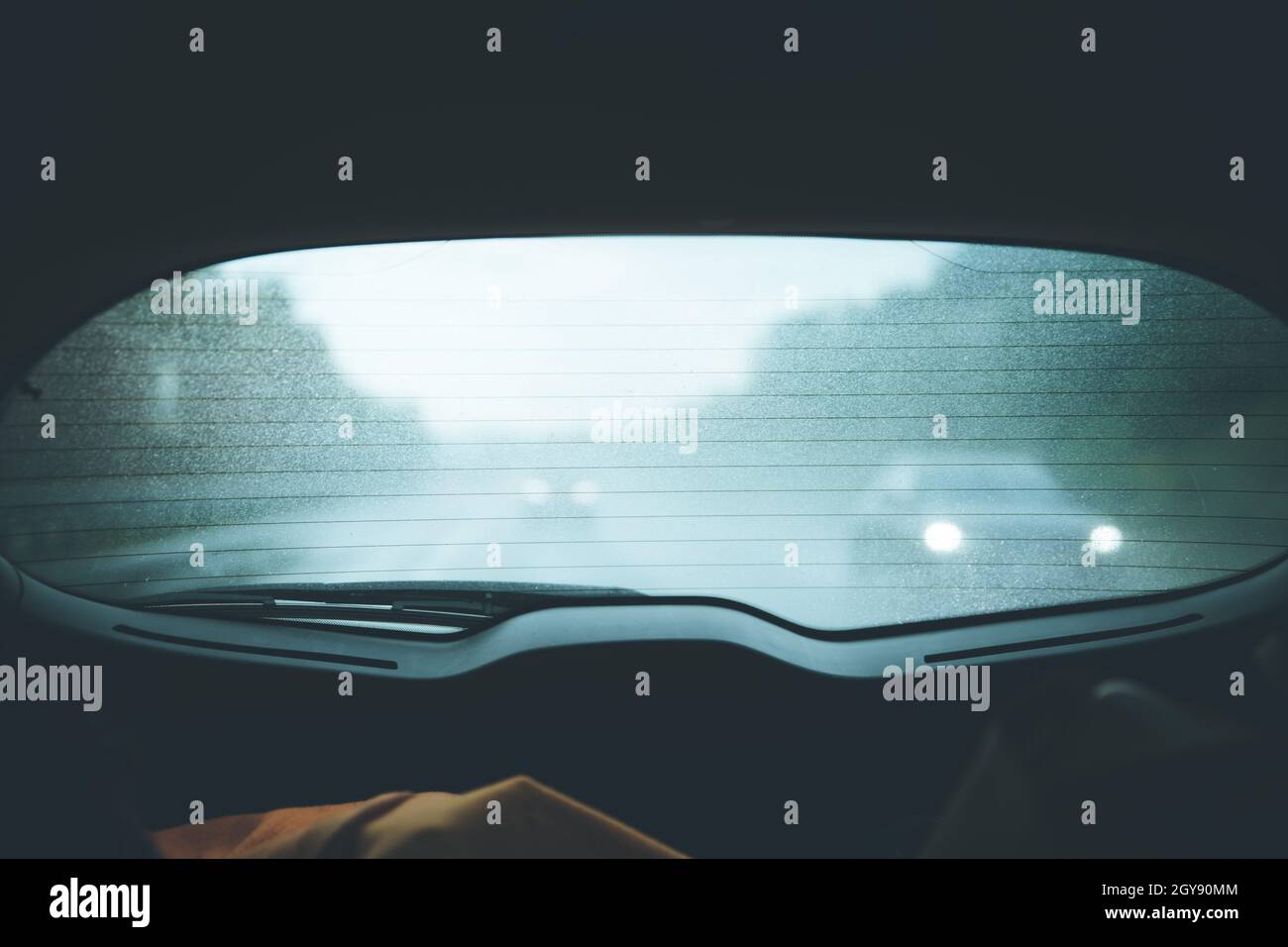 Back window of a car, rainy day, darkness Stock Photo - Alamy