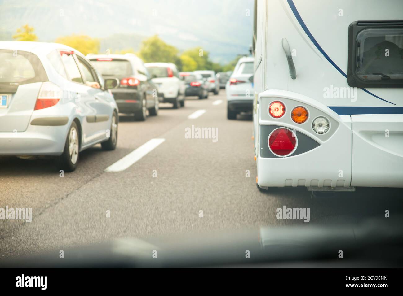 Cars on a highway, traffic jam in summer season Stock Photo - Alamy