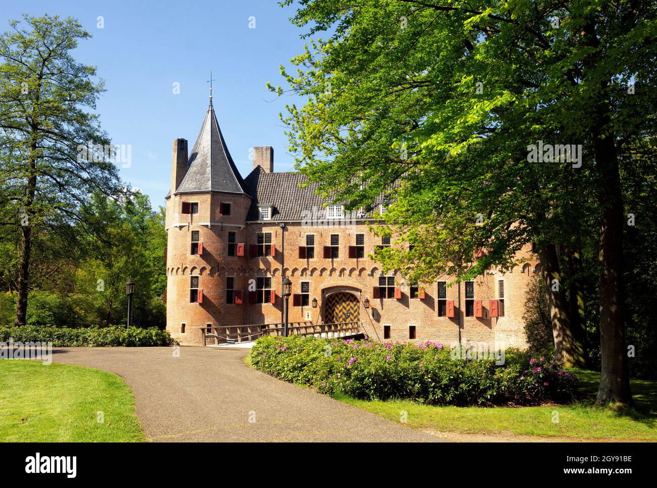 Castle Het Oude Loo seen from a distance and partly covered by trees in ...