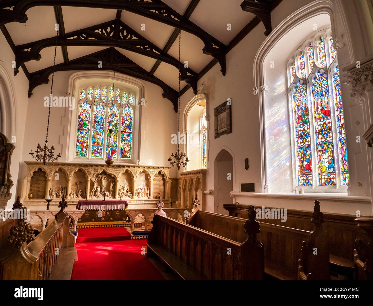 Light from a stained glass window in a church in Brome, Suffolk, UK ...