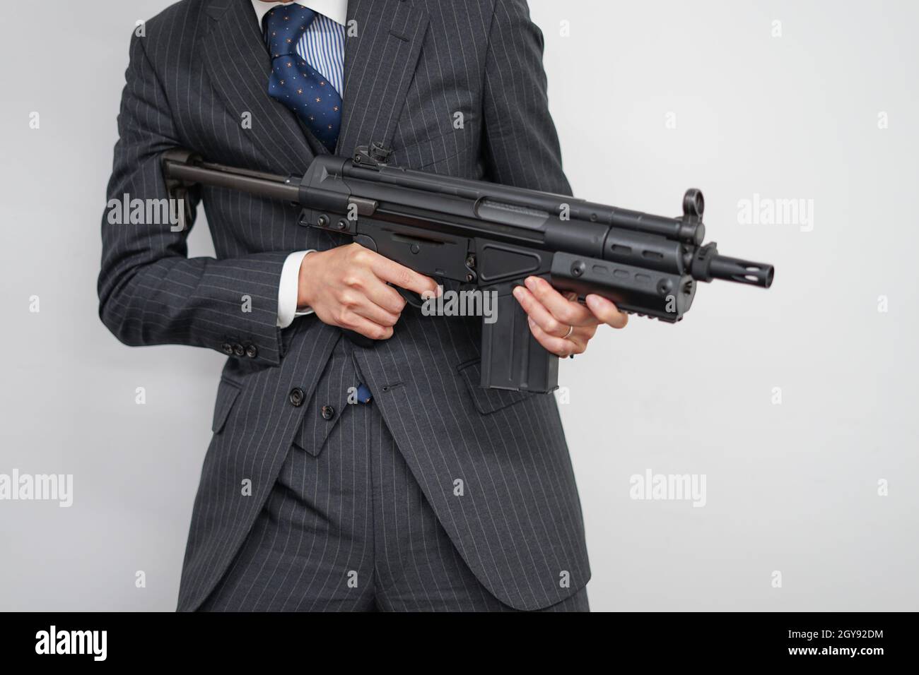 Businessman to fight with a machine gun. Shooting Location: Tokyo ...