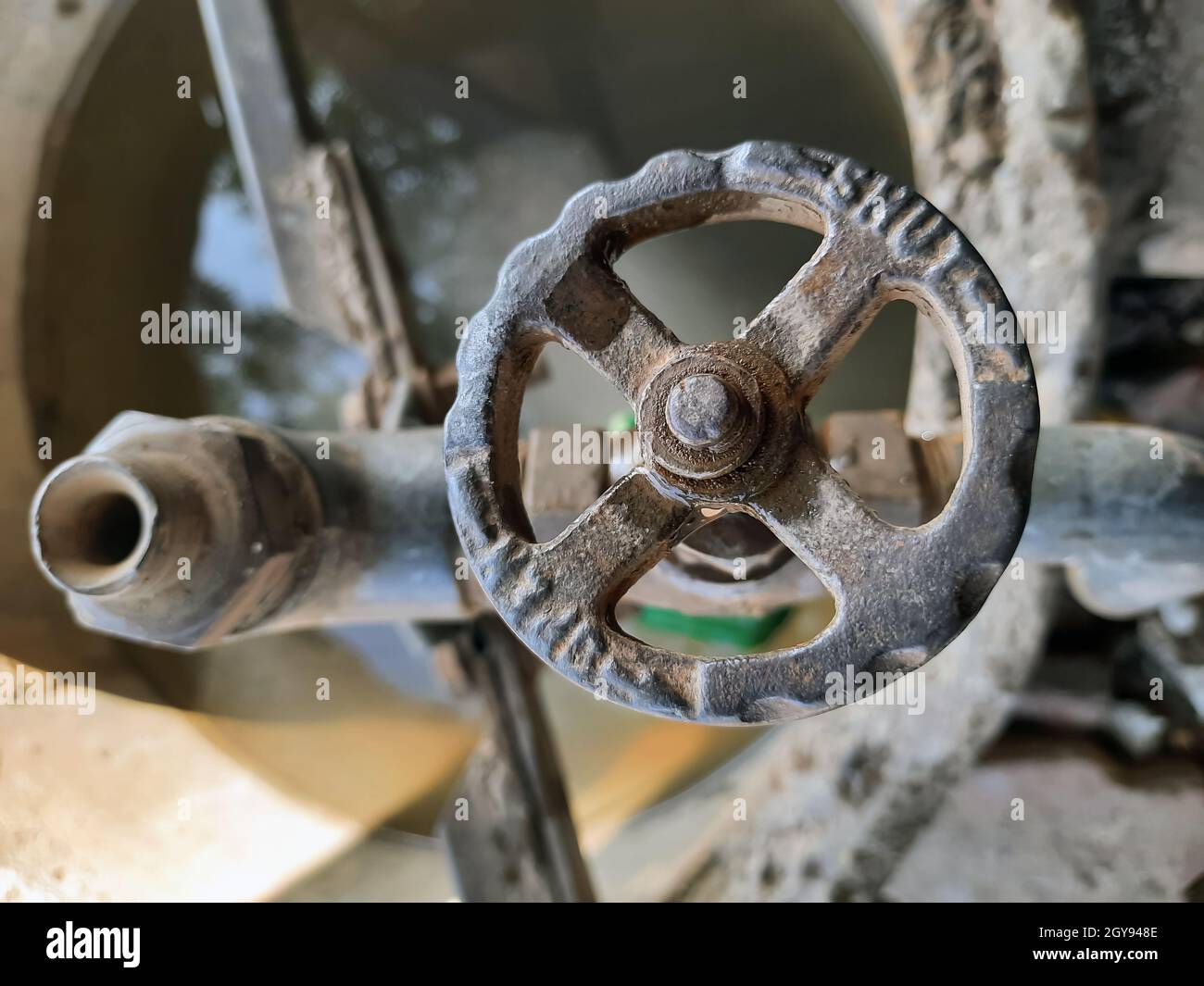 Old rusty industrial tap water pipe and valve, Detail of a pump with a ...