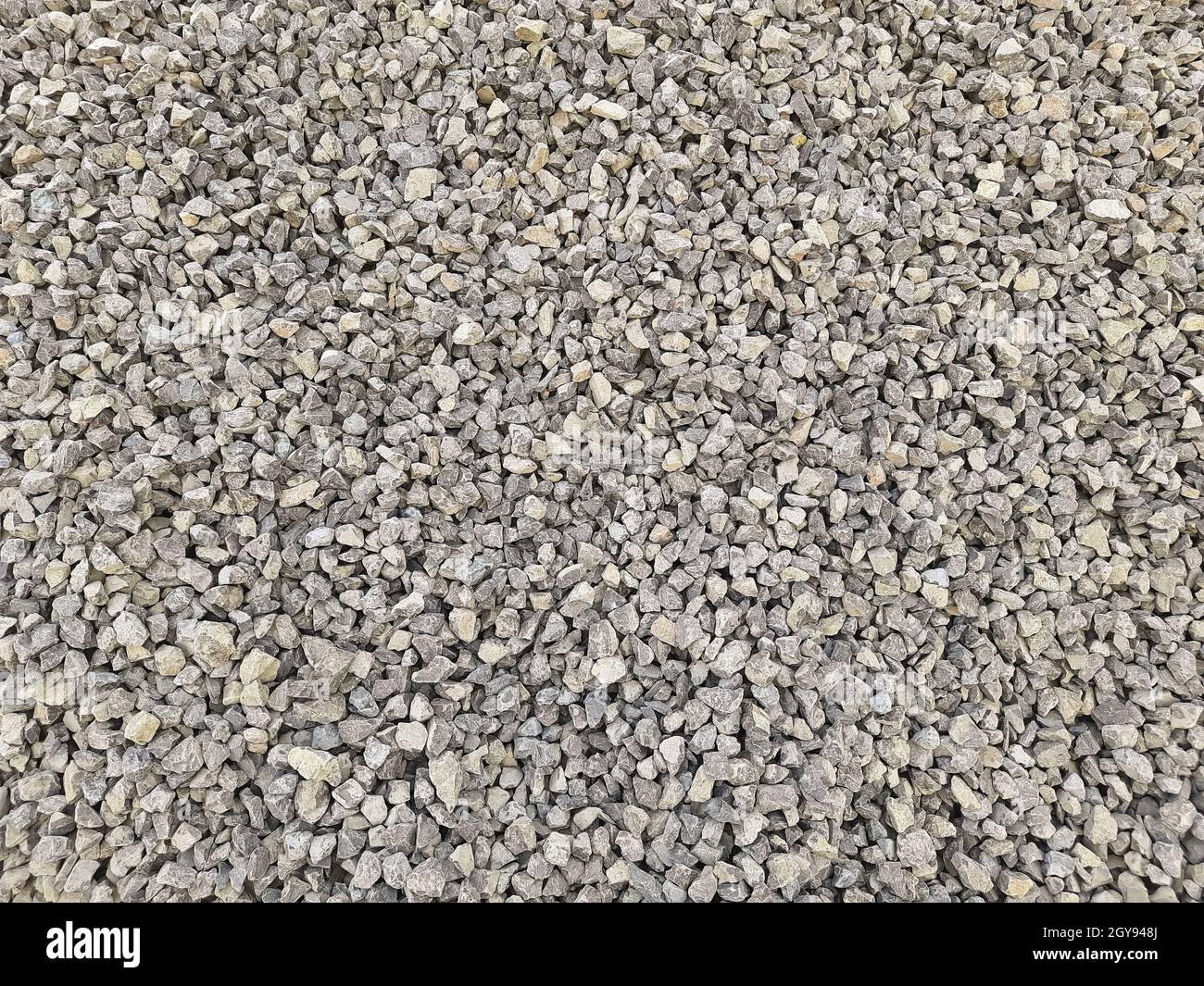 Gray small rocks ground texture. black small road stone background ...
