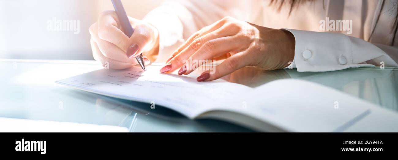 Insurance Paycheck. Payroll Check. Hand Writing Cheque Stock Photo - Alamy