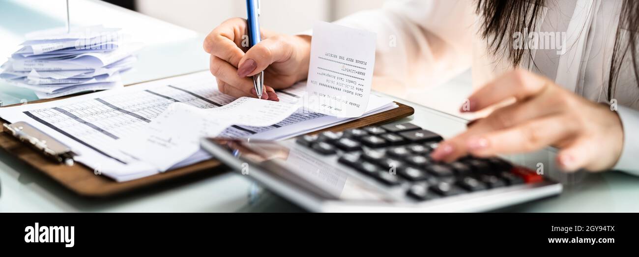 Accountant Doing Tax And Accounting Work Using Calculator Stock Photo ...