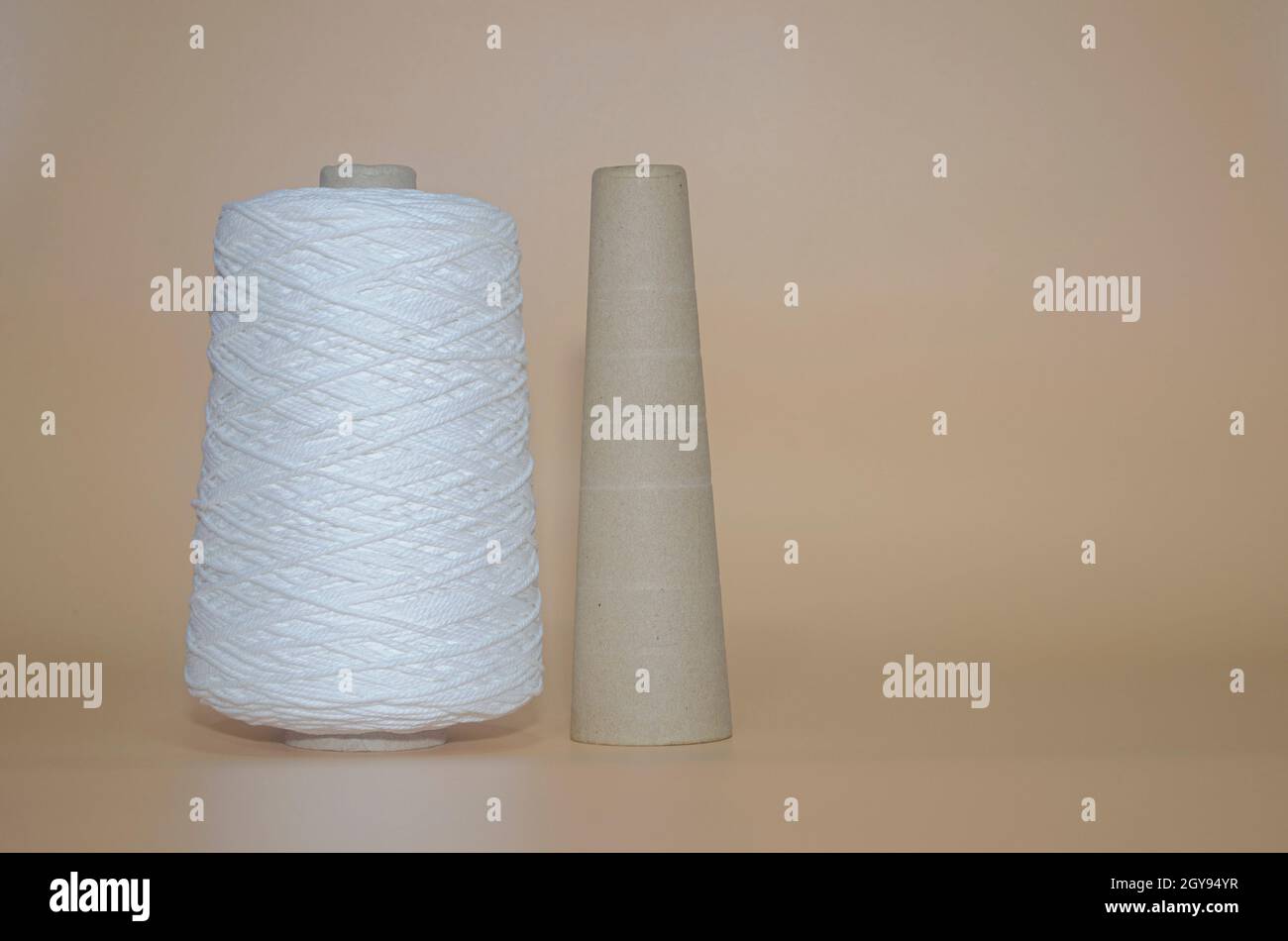 Roll of white rope for tying parcels on white background Stock Photo ...