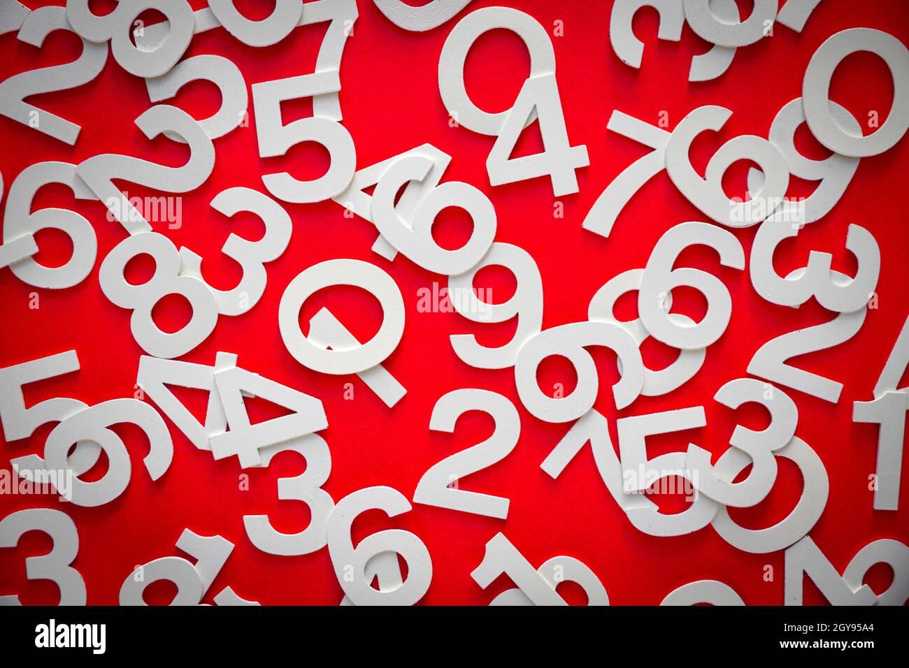 Mathematics background made with solid numbers on a board. Top view ...