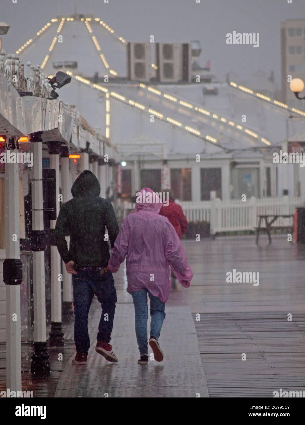 A wet day on the pier at Brighton Stock Photo - Alamy
