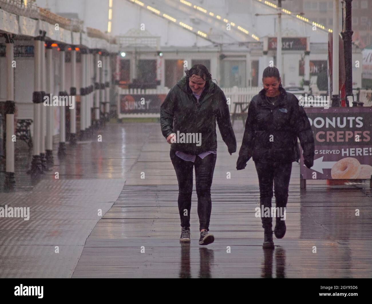 A wet day on the pier at Brighton Stock Photo - Alamy