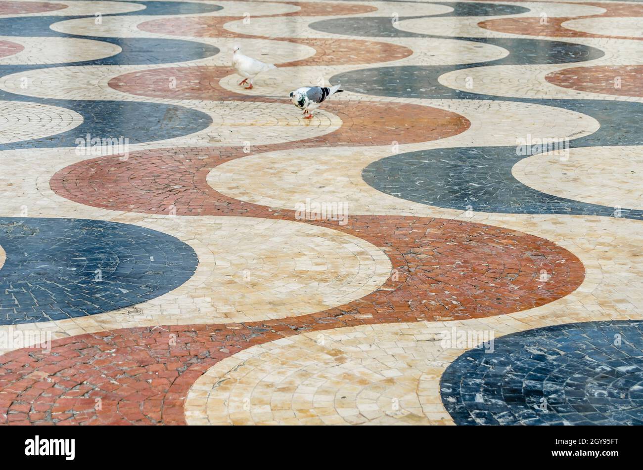 Colorful cobblestone pavement in Alicante, Spain, textured background ...