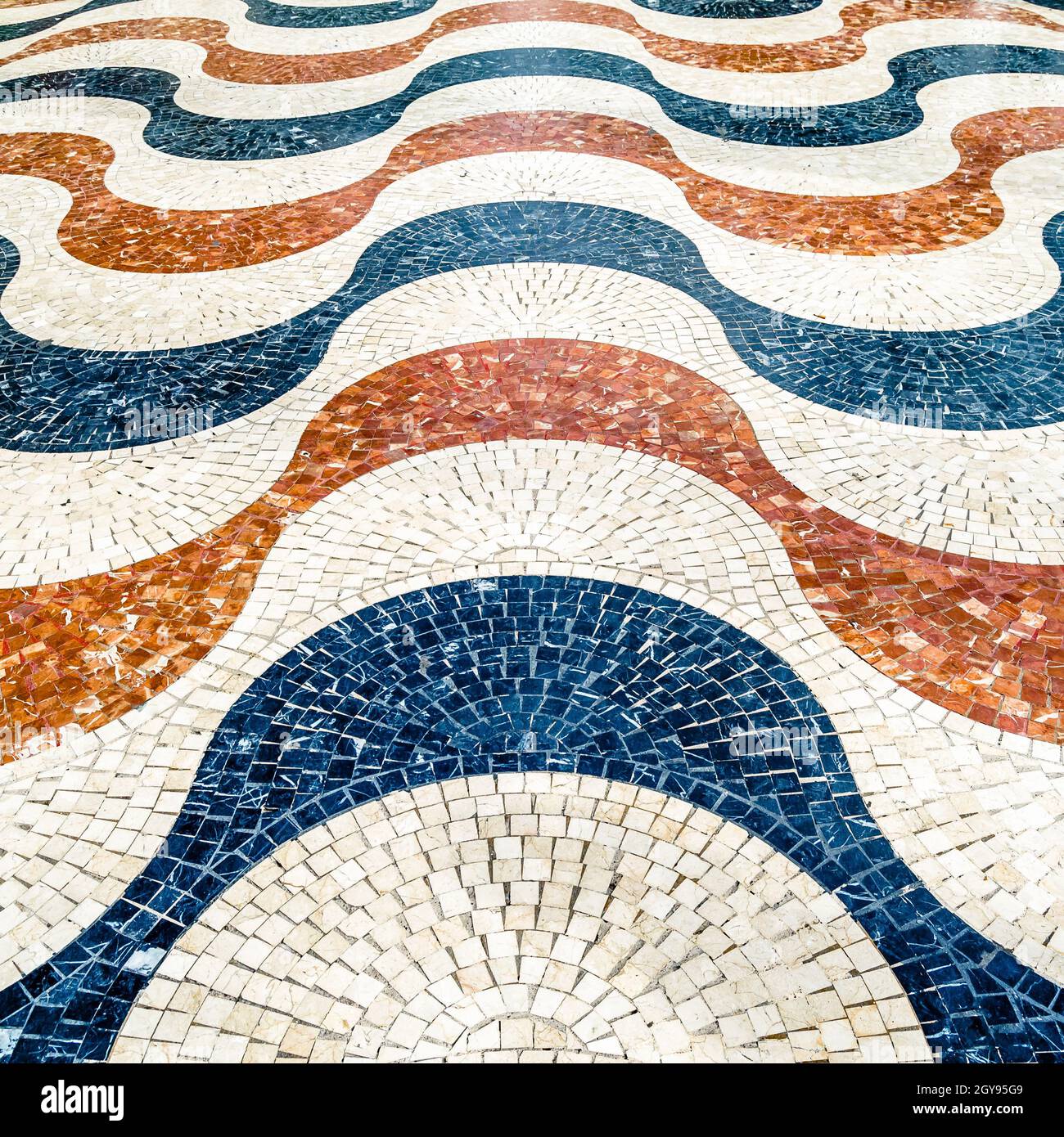 Colorful cobblestone pavement in Alicante, Spain, textured background ...