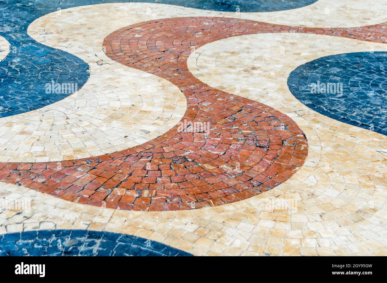 Colorful cobblestone pavement in Alicante, Spain, textured background ...