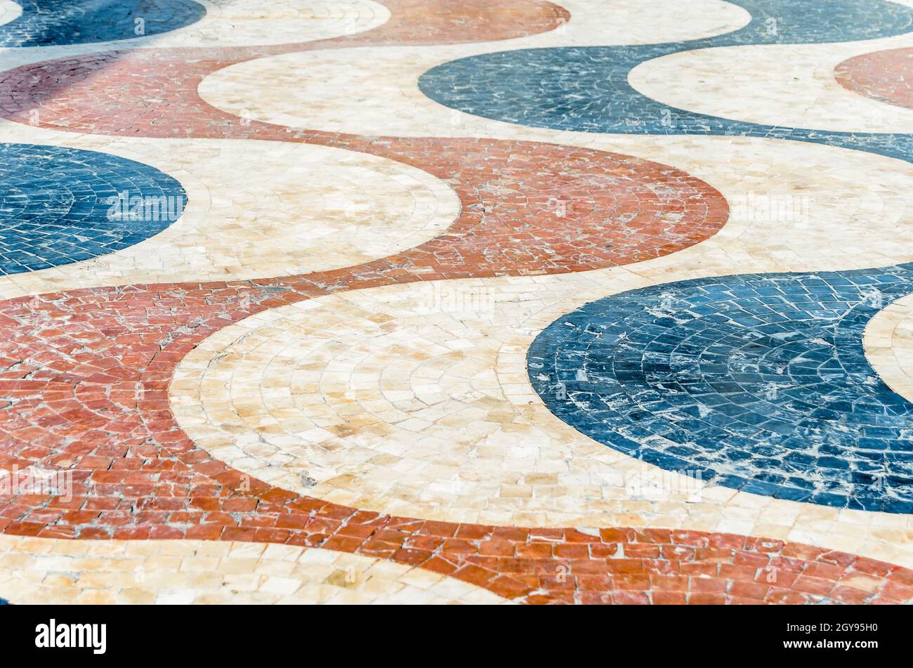 Colorful cobblestone pavement in Alicante, Spain, textured background ...