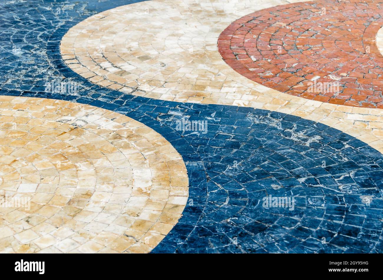 Colorful cobblestone pavement in Alicante, Spain, textured background ...