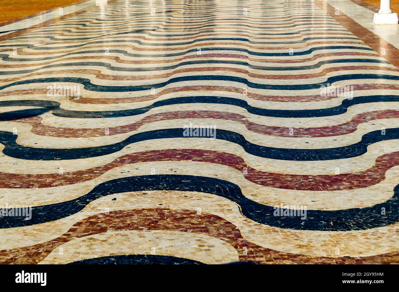 Colorful cobblestone pavement in Alicante, Spain, textured background ...