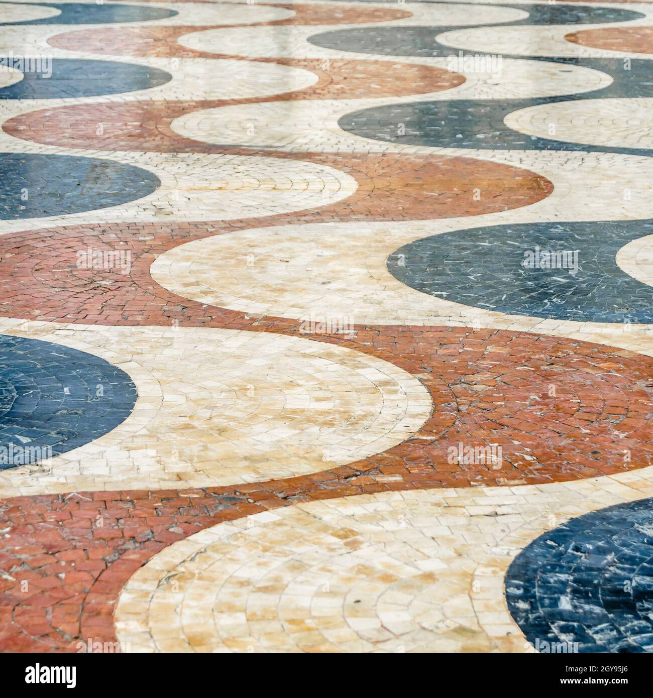 Colorful cobblestone pavement in Alicante, Spain, textured background ...