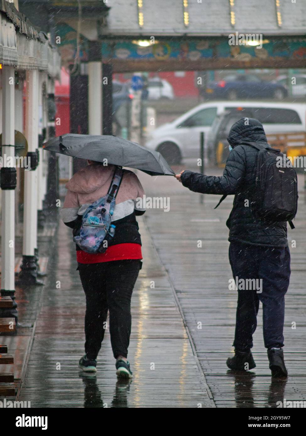 Umbrella weather brighton hi-res stock photography and images - Alamy