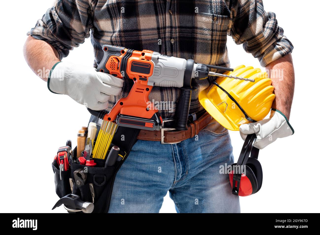 Carpenter worker at work holding the rechargeable hammer drill and ...