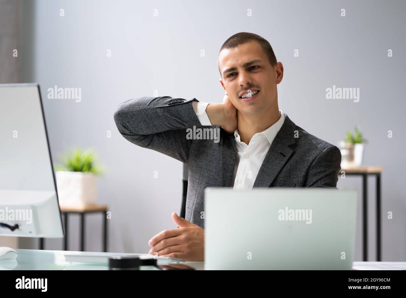 Shoulder Pain In Computer Chair. Ergonomic Posture Stock Photo - Alamy