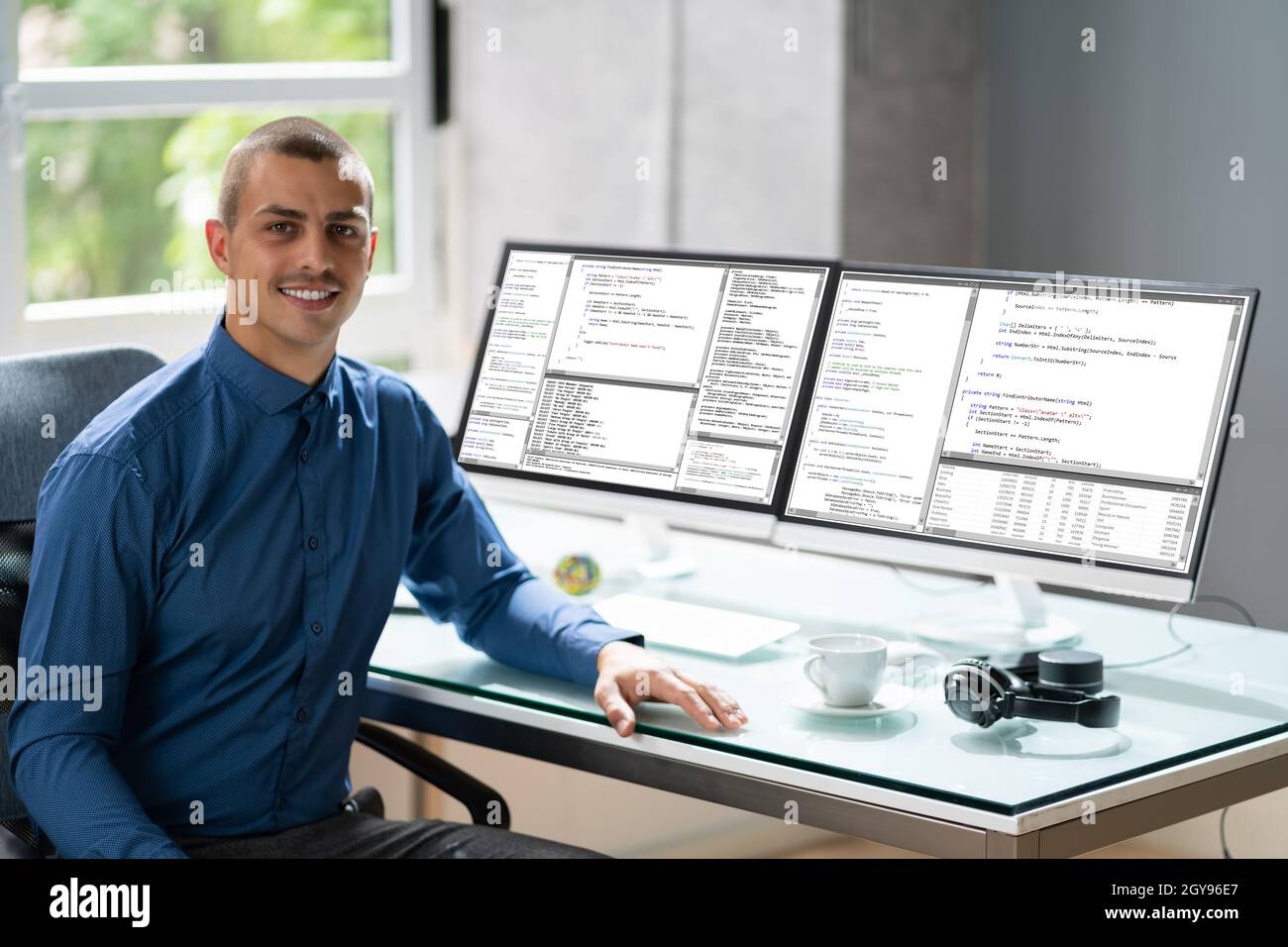 Computer Programmer Writing Program Code On Computer In Office Stock ...