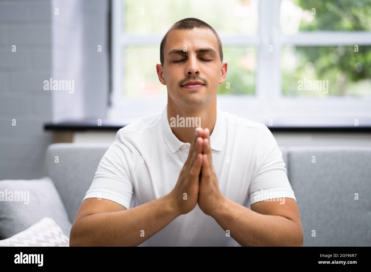 God Seeking Prayer Man In Living Room Stock Photo - Alamy