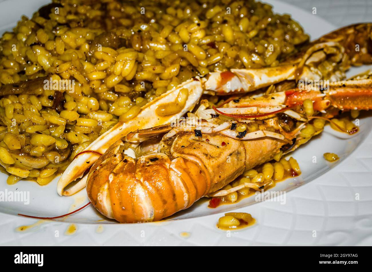 A plate of a traditional Valencian seafood rice dish, Mediterranean ...