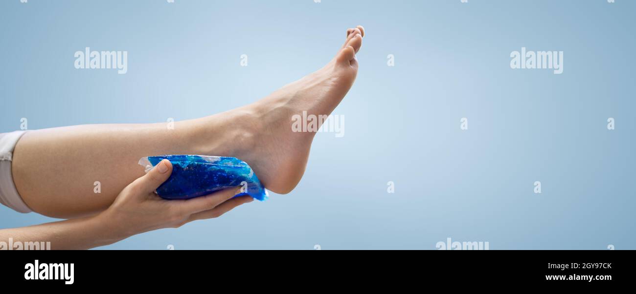Leg Injury. Icing Ankle With Cold Pack And Ice Stock Photo - Alamy