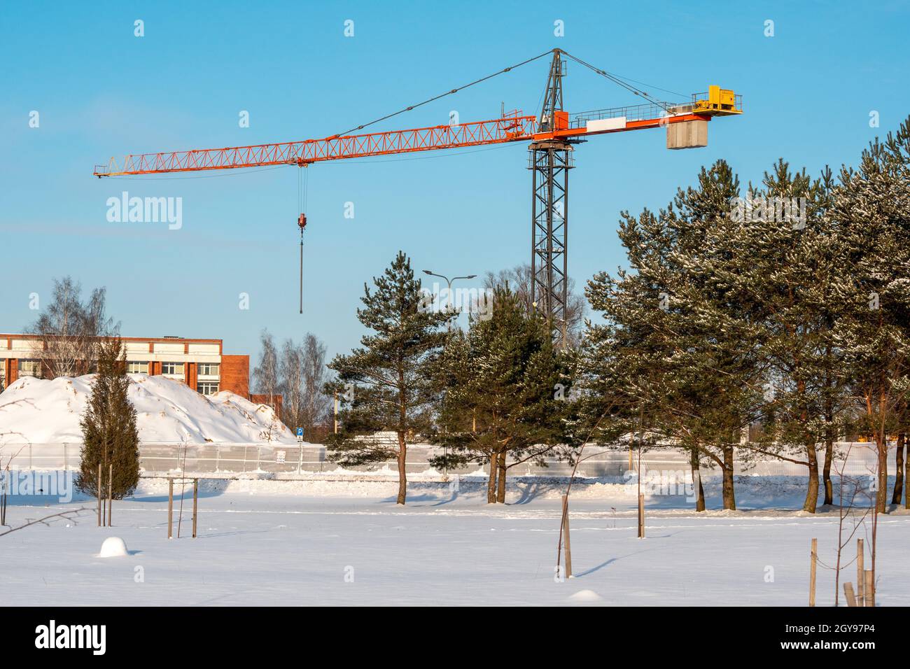 Tower crane on construction site in cold winter weather Stock Photo - Alamy
