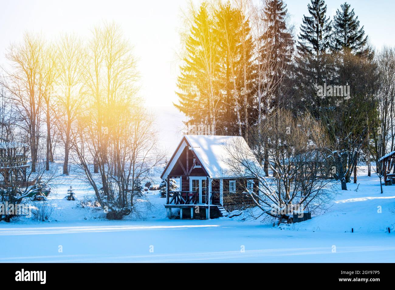 Wooden hut in forest in winter scenery Stock Photo - Alamy