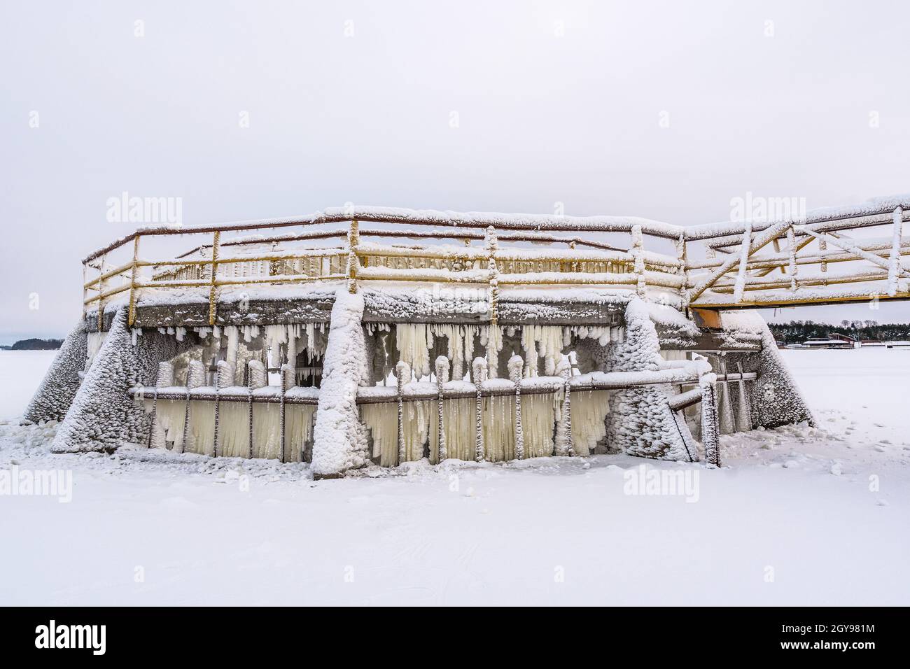 Frozen and snow covered metal dam construction. Extremely Cold Weather ...