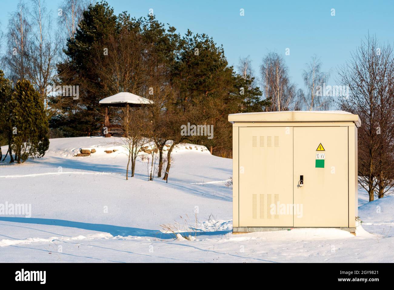 Outdoor electric high voltage distribution cabinet on a sunny winter ...