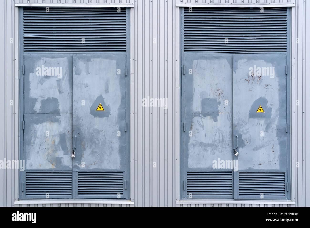 Iron gray door of a transformer box. Electricity, high voltage, do not ...