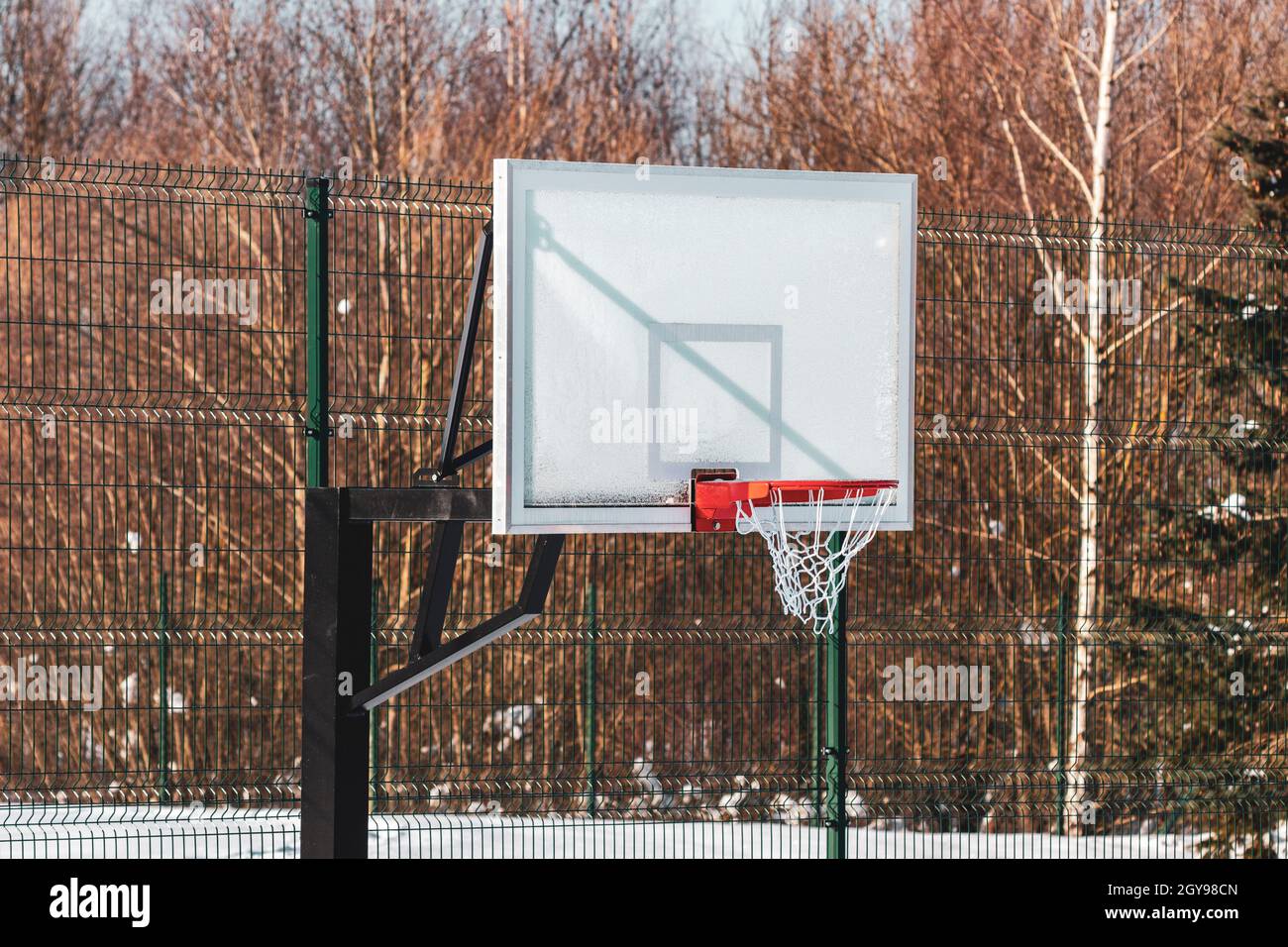 Outdoor basketball hoop with net, covered by hoarfrost Stock Photo - Alamy
