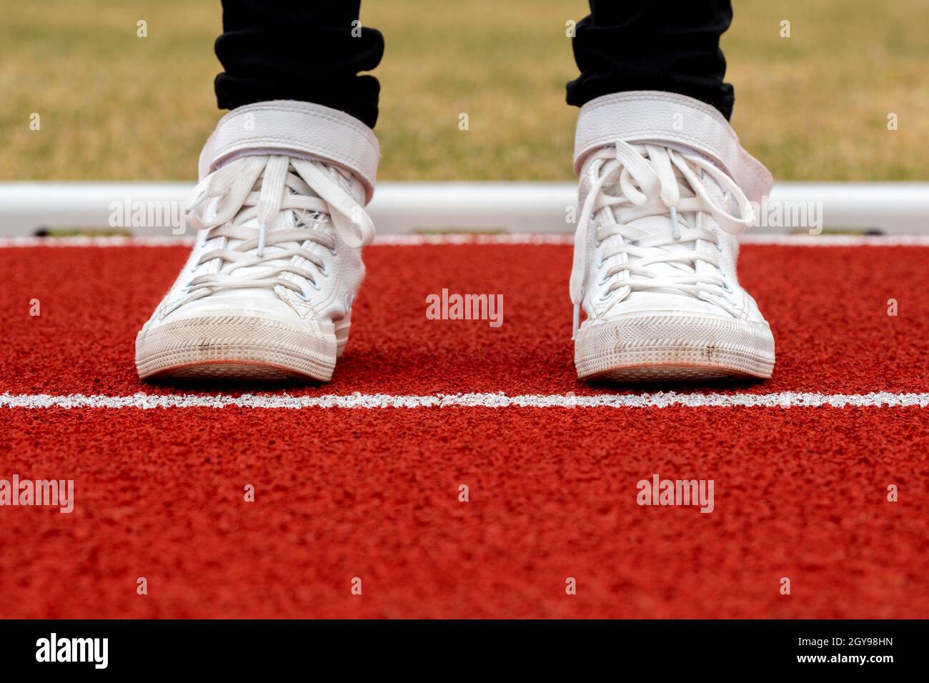 Close-up on child feet with sneakers on the running track Stock Photo ...